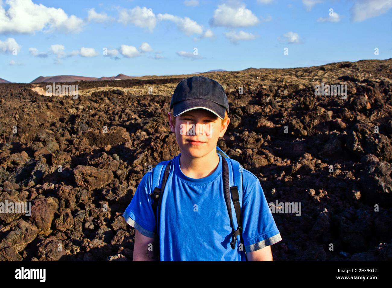 young boy walking through volcanic area in Lanzarote Stock Photo - Alamy