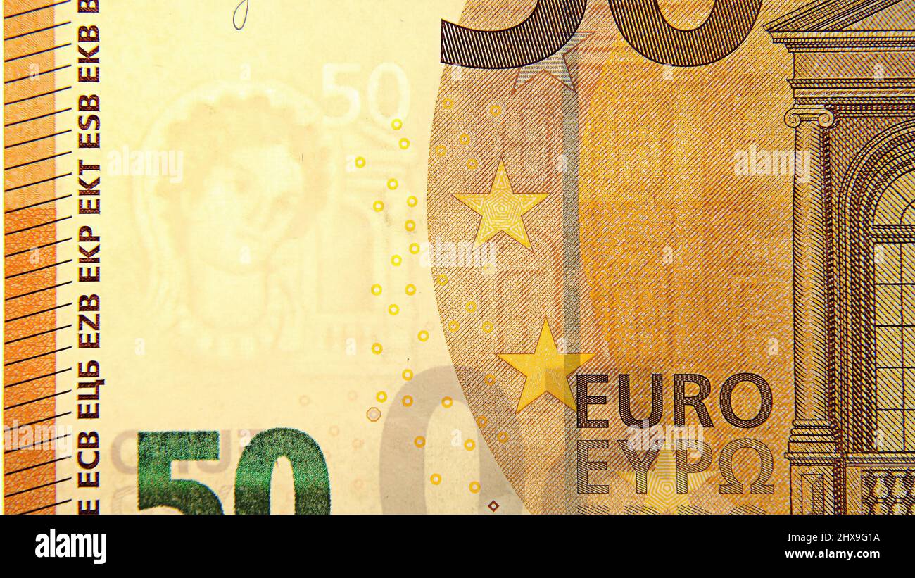 A fifty-euro bill illuminated by light. Water signs. Paper money. Cash ...