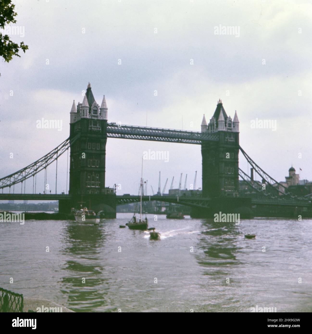 London Bridge and boats in the River Thames in London England ca. 1971 ...