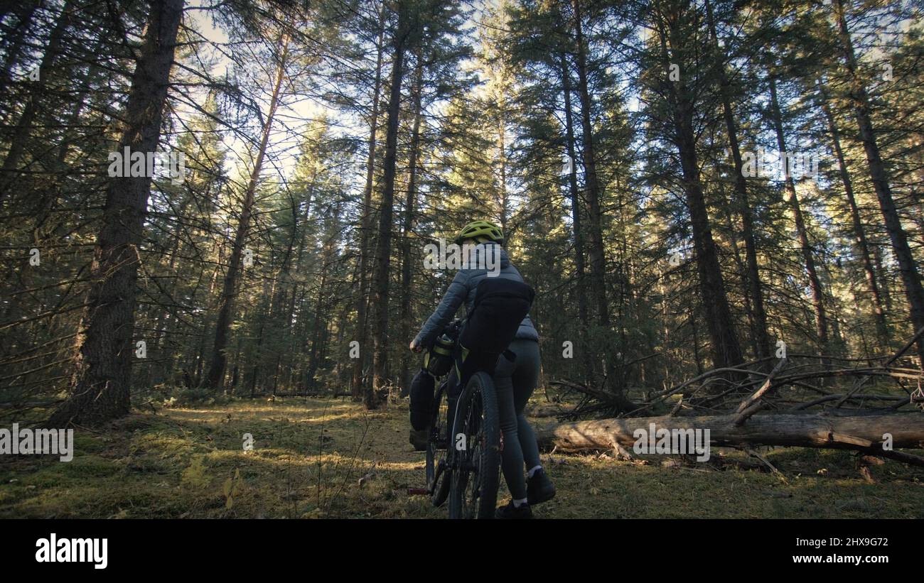 The woman travel on mixed terrain cycle touring with bike bikepacking ...