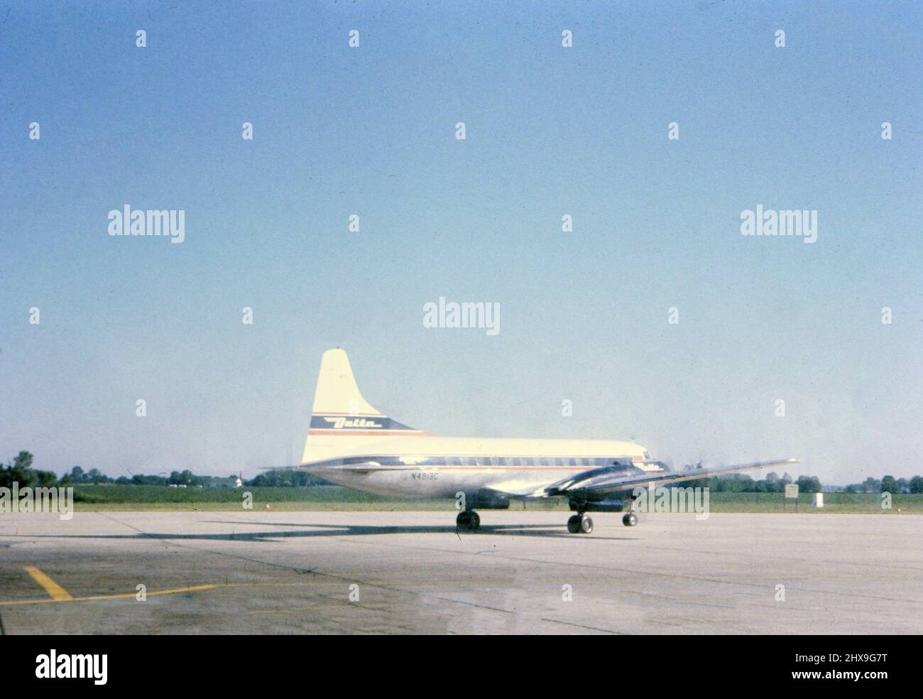 Delta Airlines airplane on tarmac preparing for take off ca. late 1950s ...