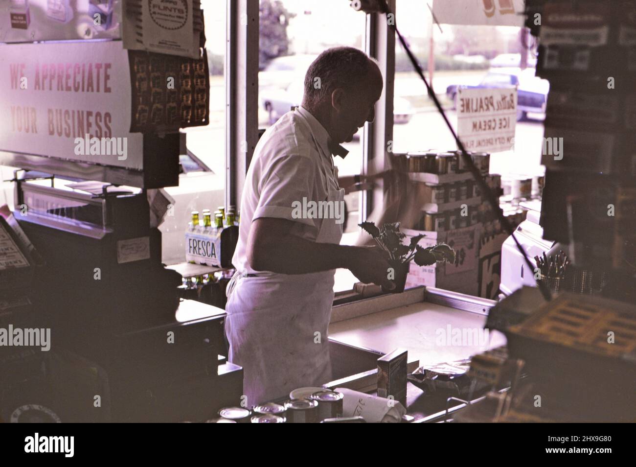 1960s check out clerk hi-res stock photography and images - Alamy