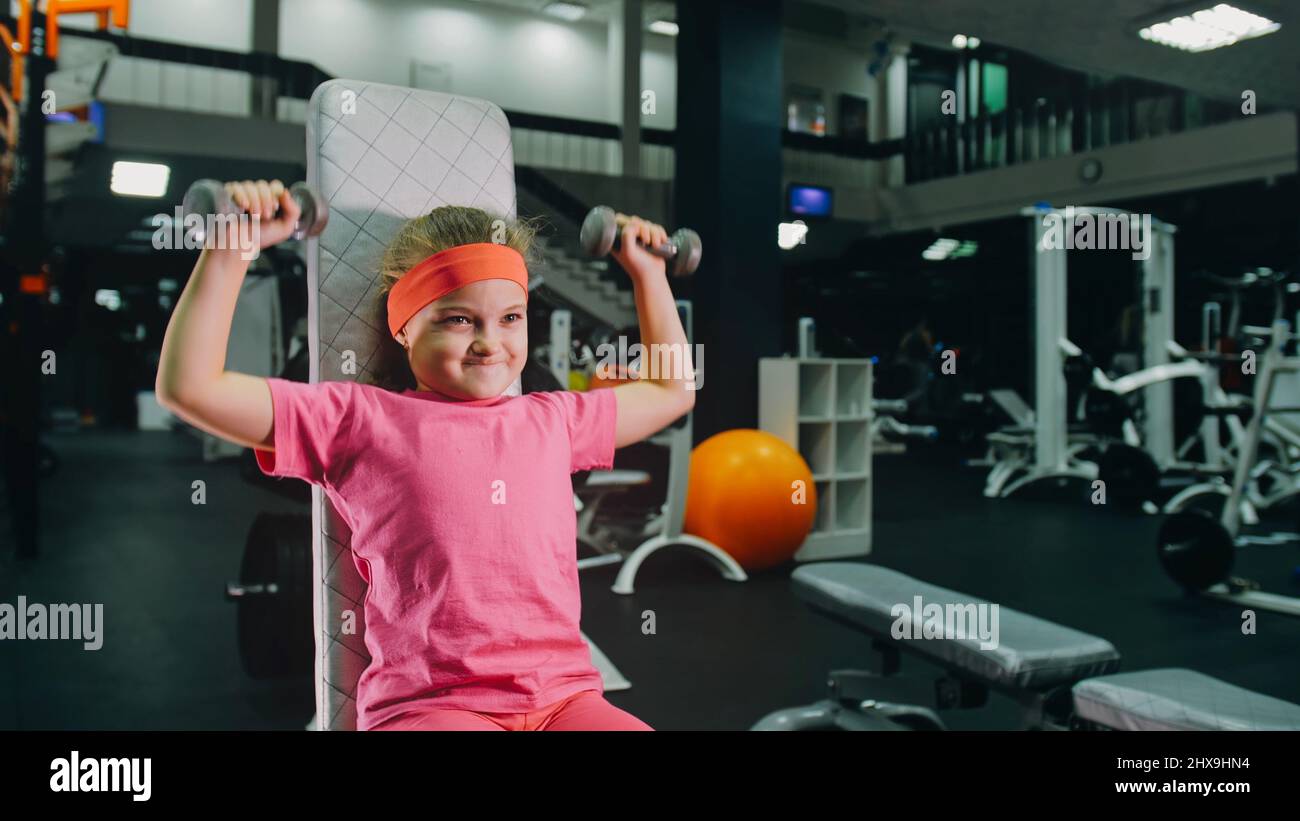 Fit Athletic Baby Girl Work out with Dumbbell, Doing Her Fitness ...