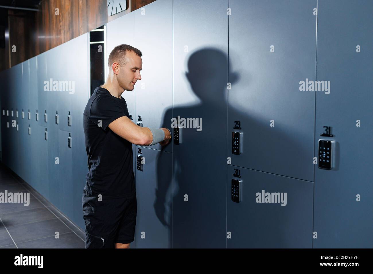 Before training. Handsome man getting ready for workout Stock Photo - Alamy
