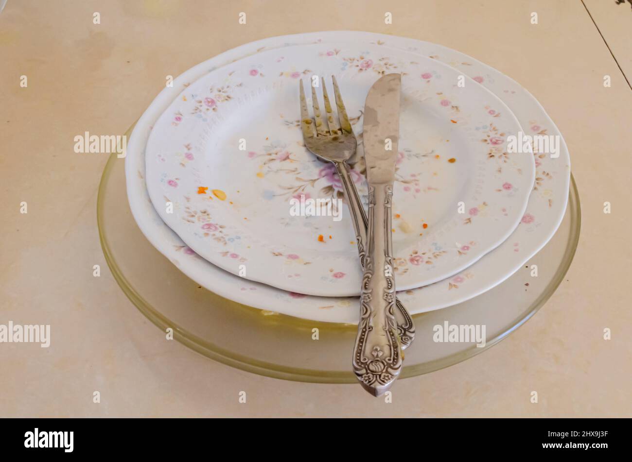 Dirty Plates And Cutlery Stock Photo - Alamy