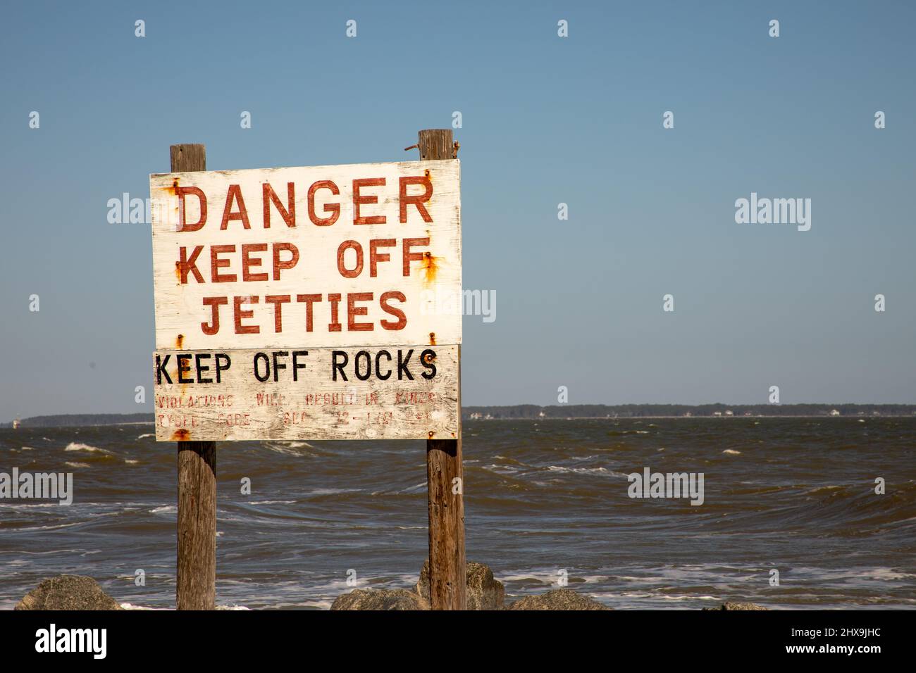 Warning sign rocky beach seaside hi-res stock photography and images ...