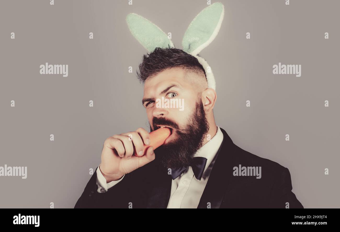Happy easter and funny easter day. Bunny rabbit man eat carrot. Cute ...