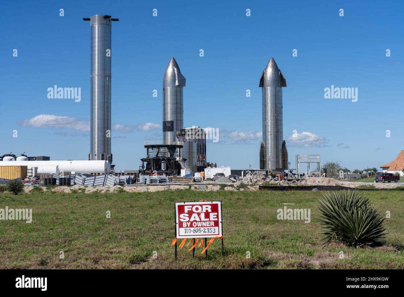 A for sale sign in front of the SpaceX production and assembly location ...