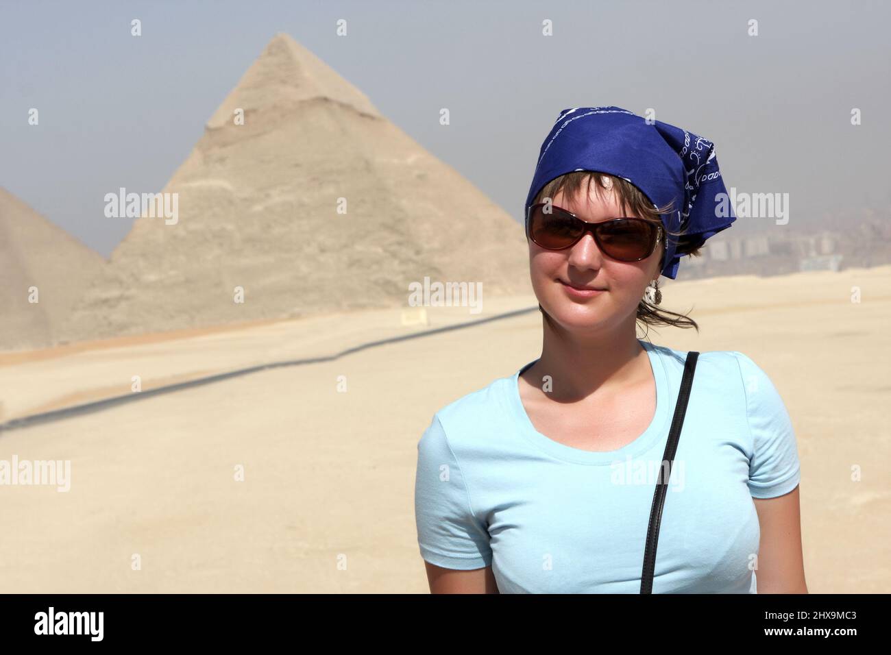 The woman poses on a pyramids background, Egypt Stock Photo - Alamy