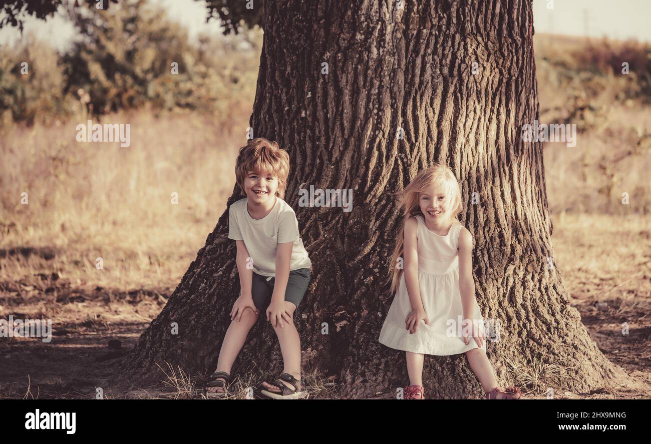 Eco living. Happy children farmers having fun on spring field. Children ...