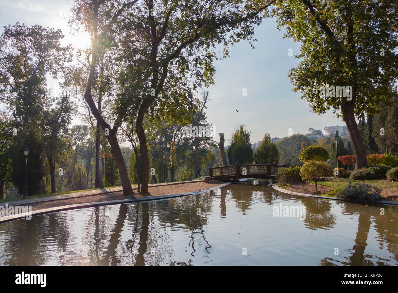 Beautiful bridge in wooded park during the falls. The Emirgan Park is ...