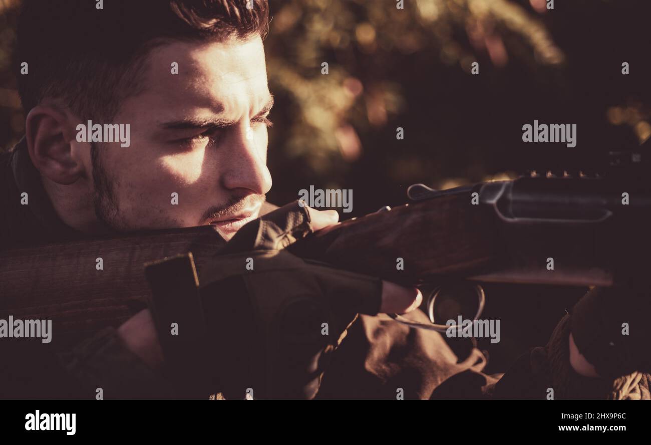 Hunting in spring forest. Hunter with shotgun gun on hunt. Calibers of ...