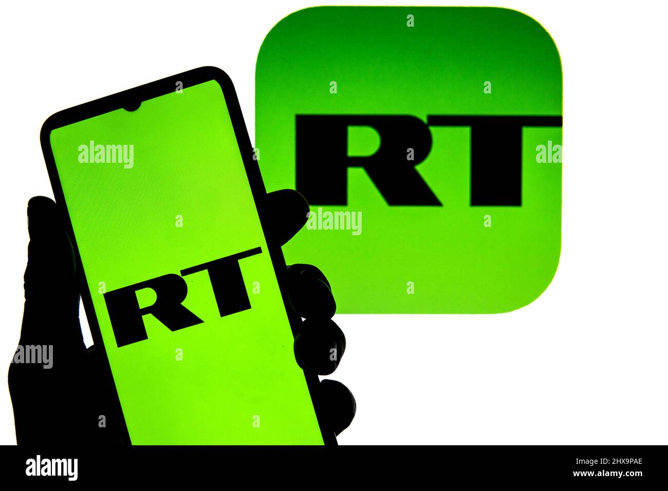 In this photo illustration a RT logo seen displayed on a smartphone ...