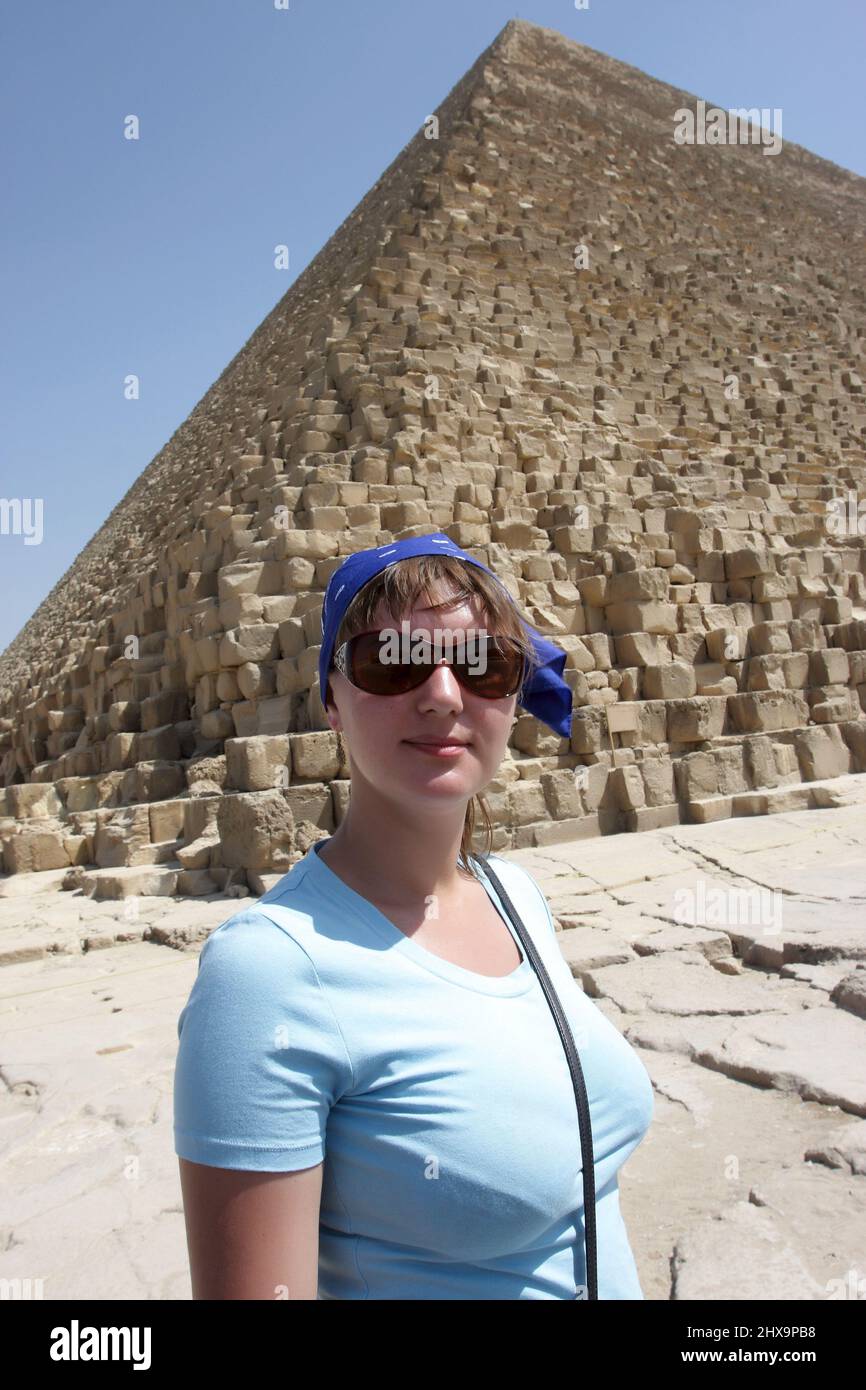 The tourist poses on the Great Pyramid background Stock Photo - Alamy