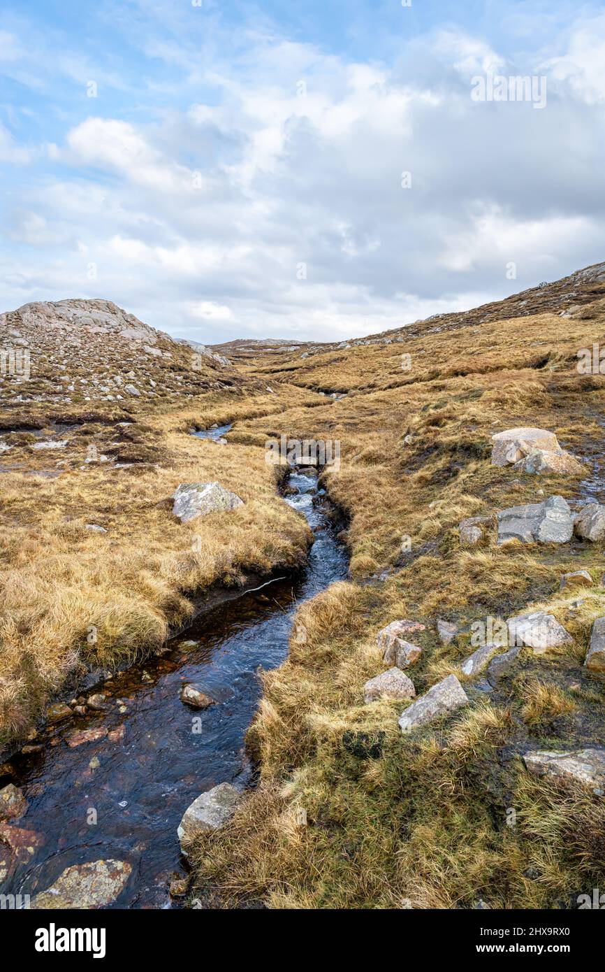 Stream running through peat bog on Isle of Lewis in the Outer Hebrides ...