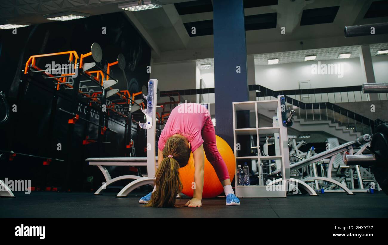 Fit Athletic Baby Girl Work out Stretching, Doing Her Fitness Exercise ...