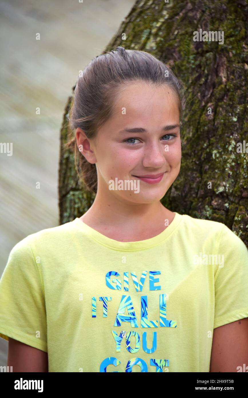 Closeup of young girl shows her cute expression of impish and ...