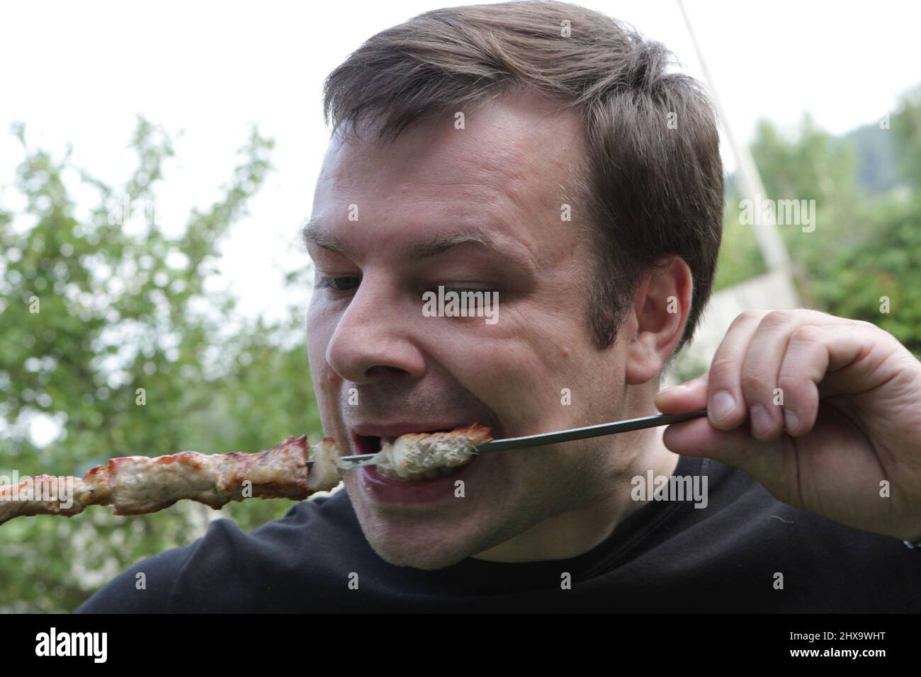 Fat man eating kebab hi-res stock photography and images - Alamy