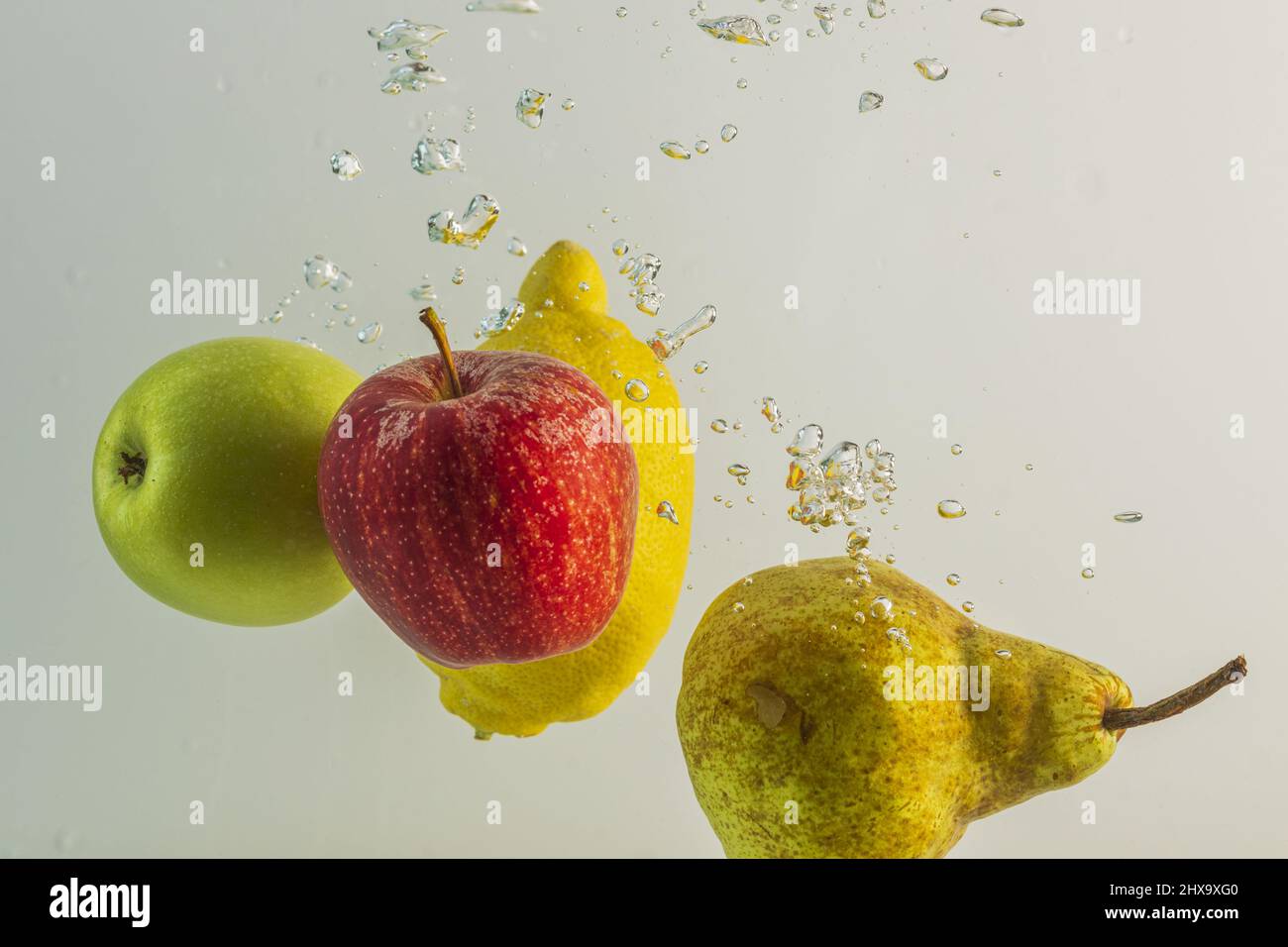 Beautiful view of colorful fruits floating in water Stock Photo - Alamy
