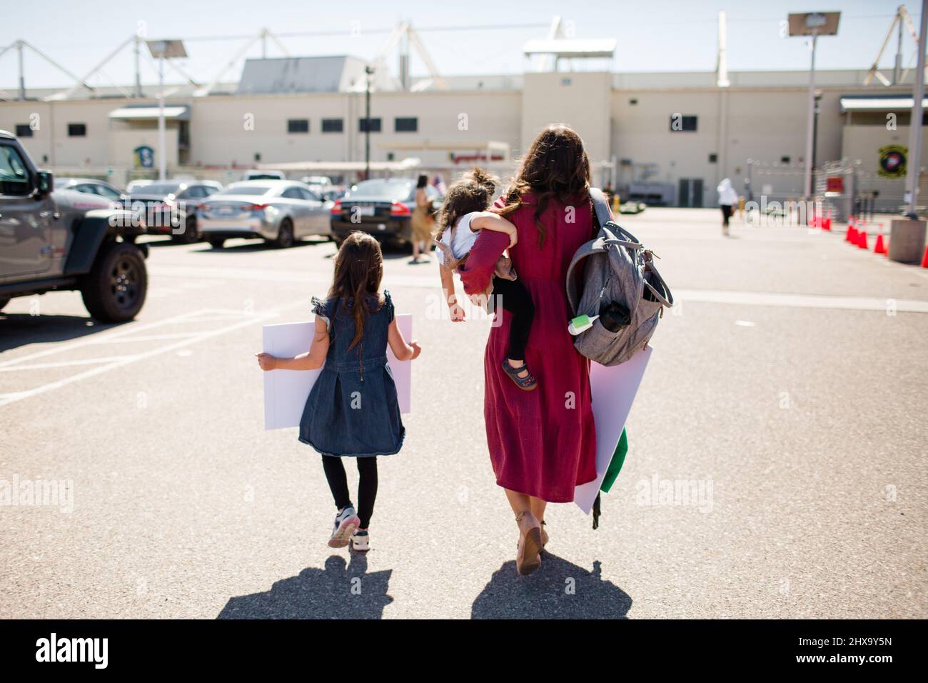Mother & Two Daughters Walking Onto Base for Military Homecoming Stock ...