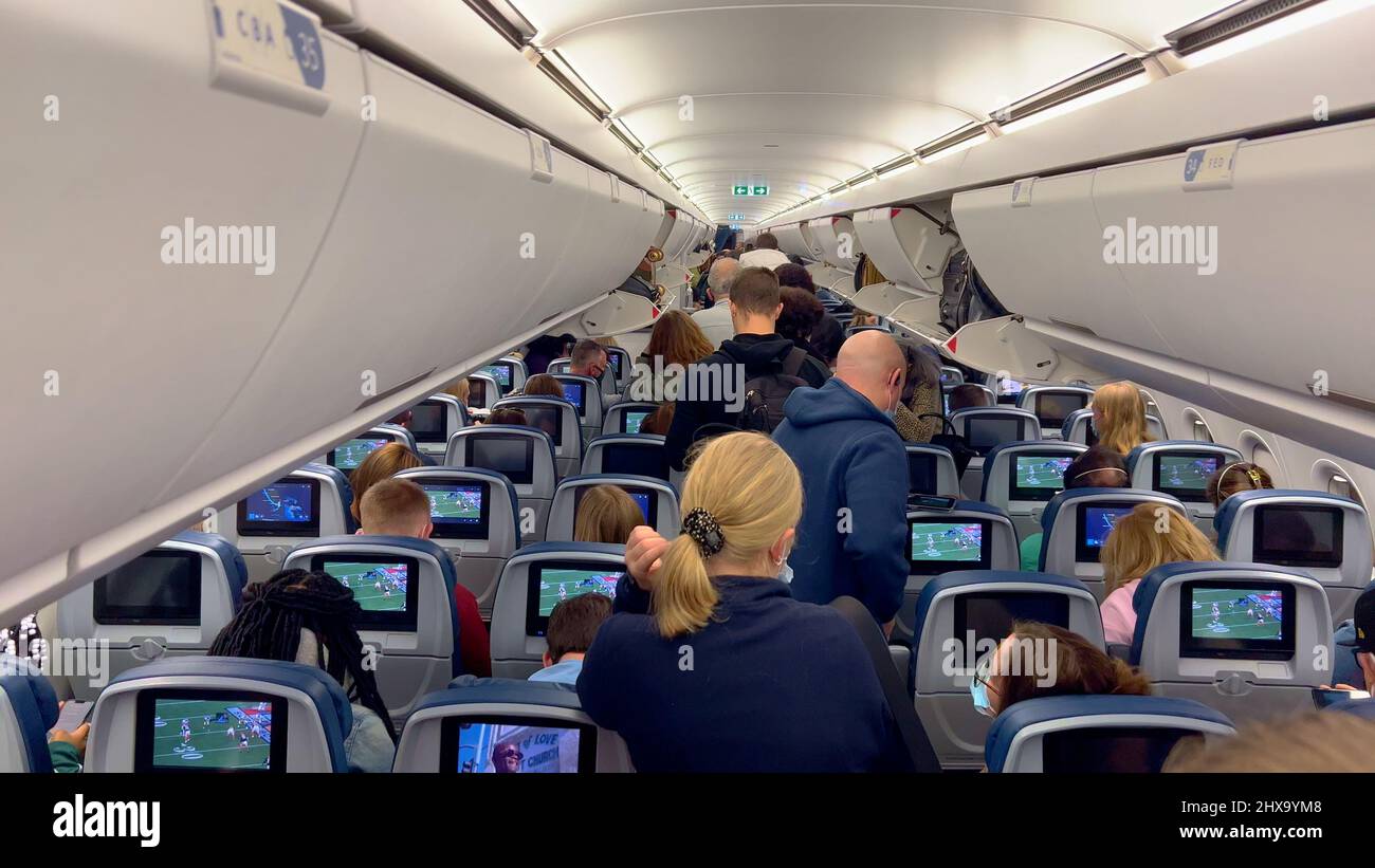 Passengers get ready for unboarding the airplane - MIAMI, UNITED STATES ...