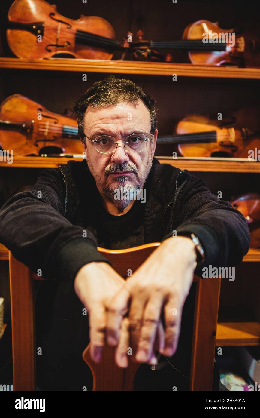Violin maker (luthier) in his showroom Stock Photo - Alamy