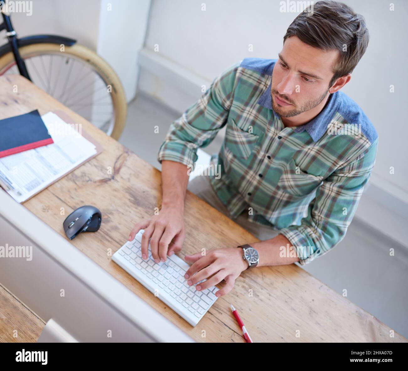 This is the hard work behind the dream. Top view of a handsome young ...
