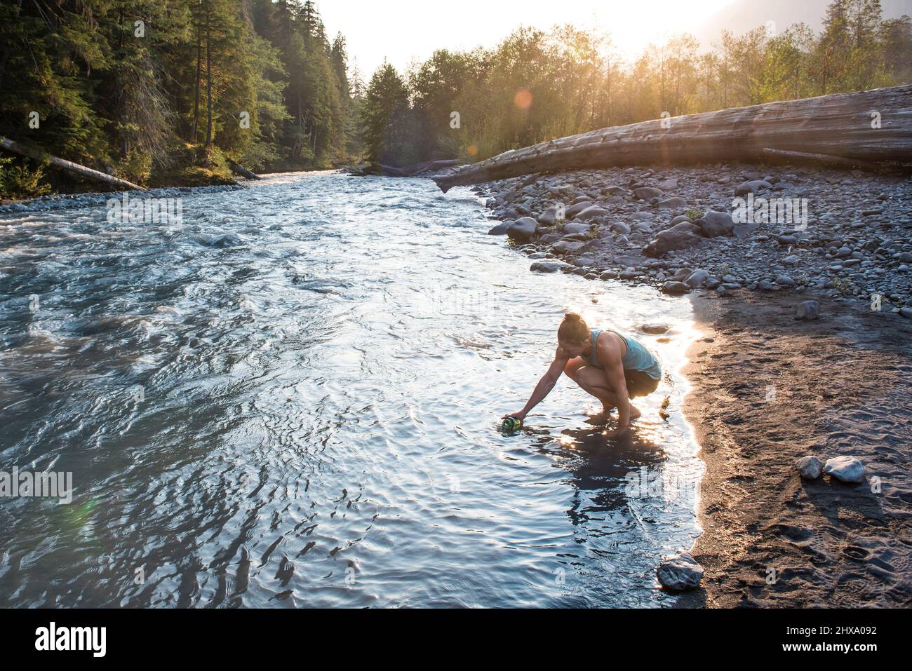 Woman fills a bottle hi-res stock photography and images - Alamy