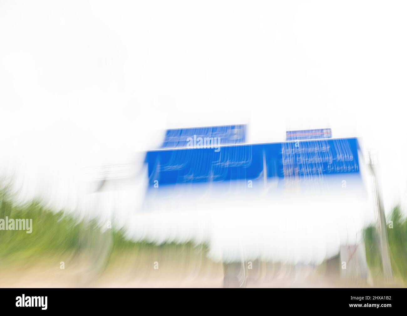 Distorted view by a driver during fast commuting on the highway of the ...