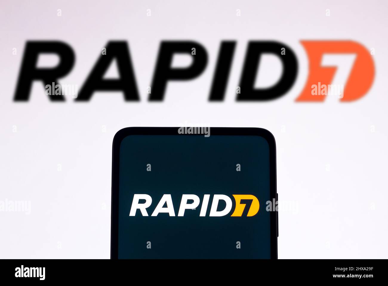 In this photo illustration the Rapid7 logo seen displayed on a ...