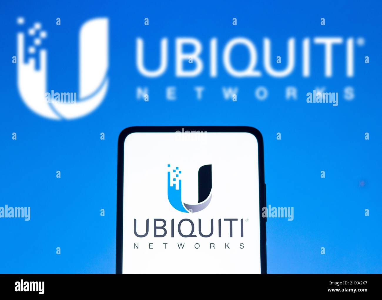 In this photo illustration the Ubiquiti logo seen displayed on a ...