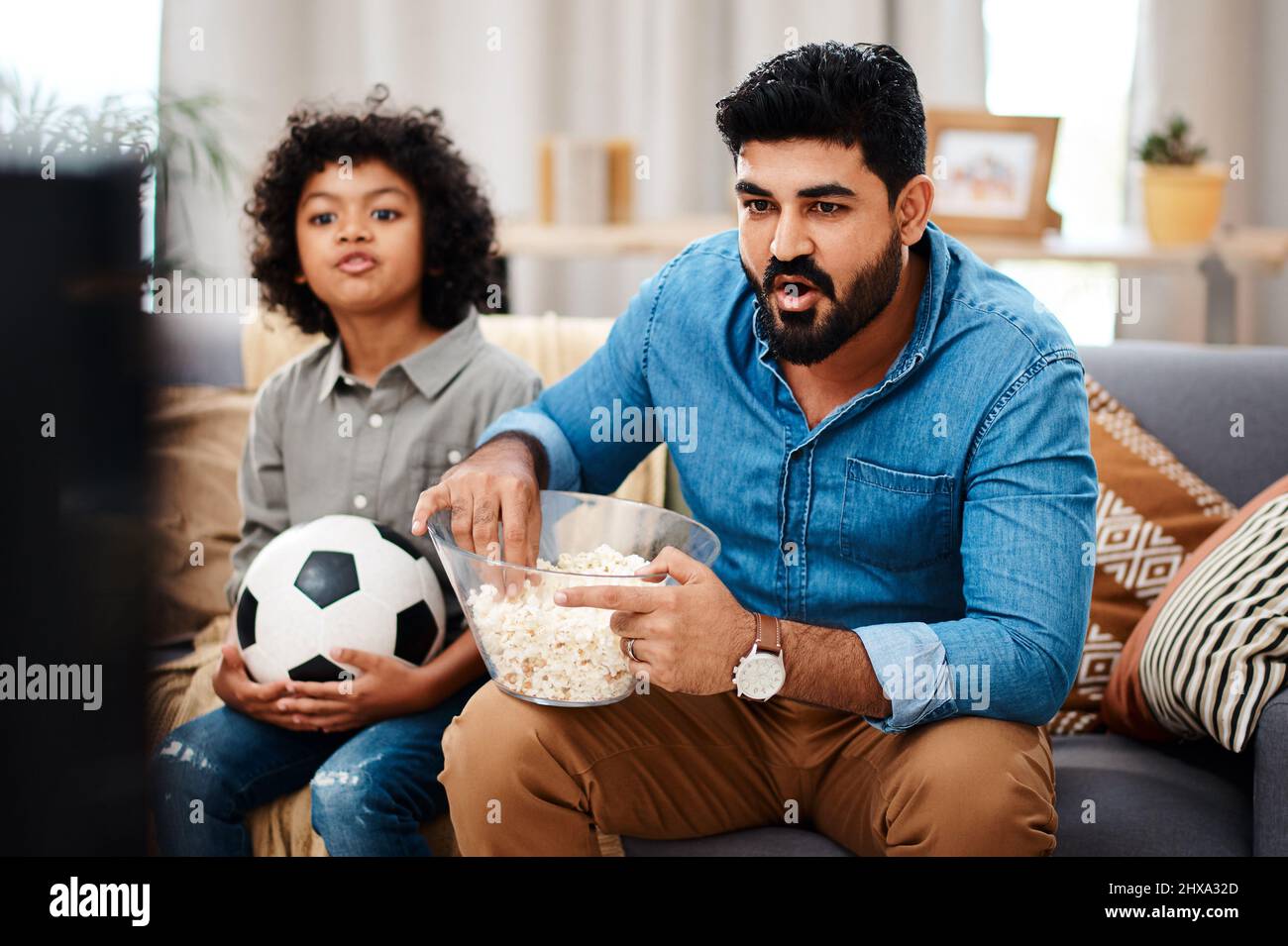 Were both avid sports fans. Cropped shot of an adorable little boy ...
