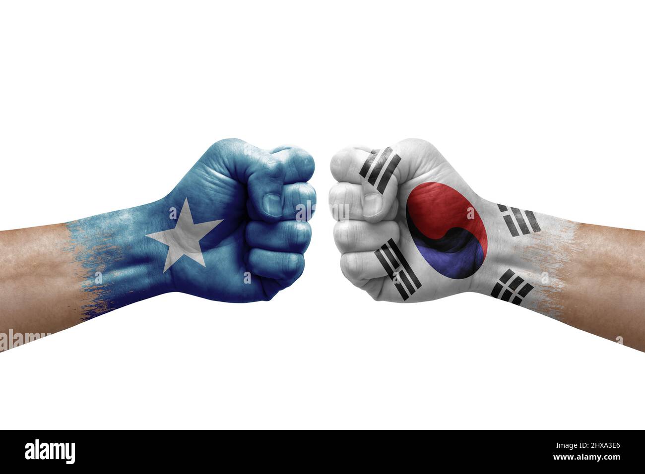 Two hands punch to each others on white background. Country flags ...