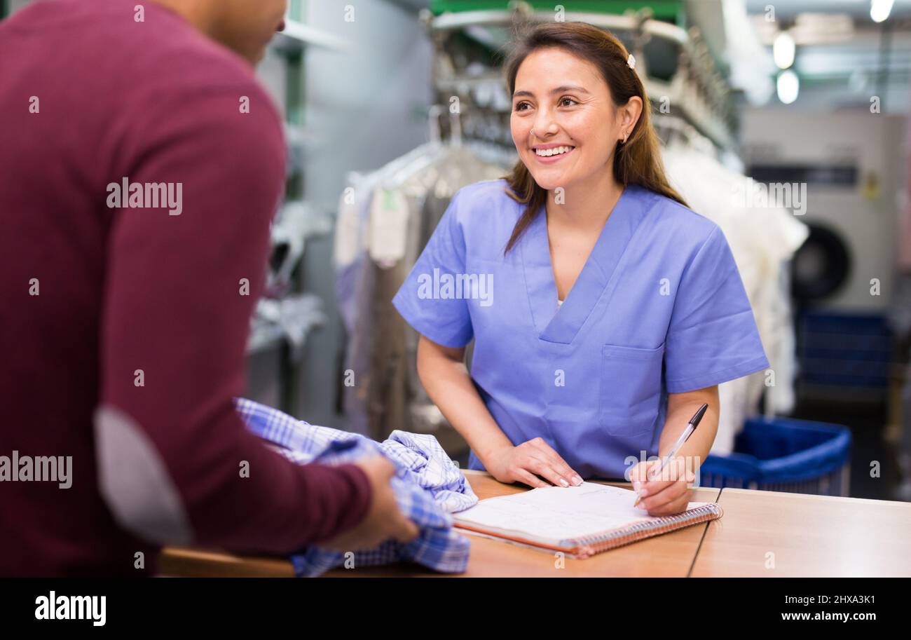 Laundry employee hi-res stock photography and images - Alamy