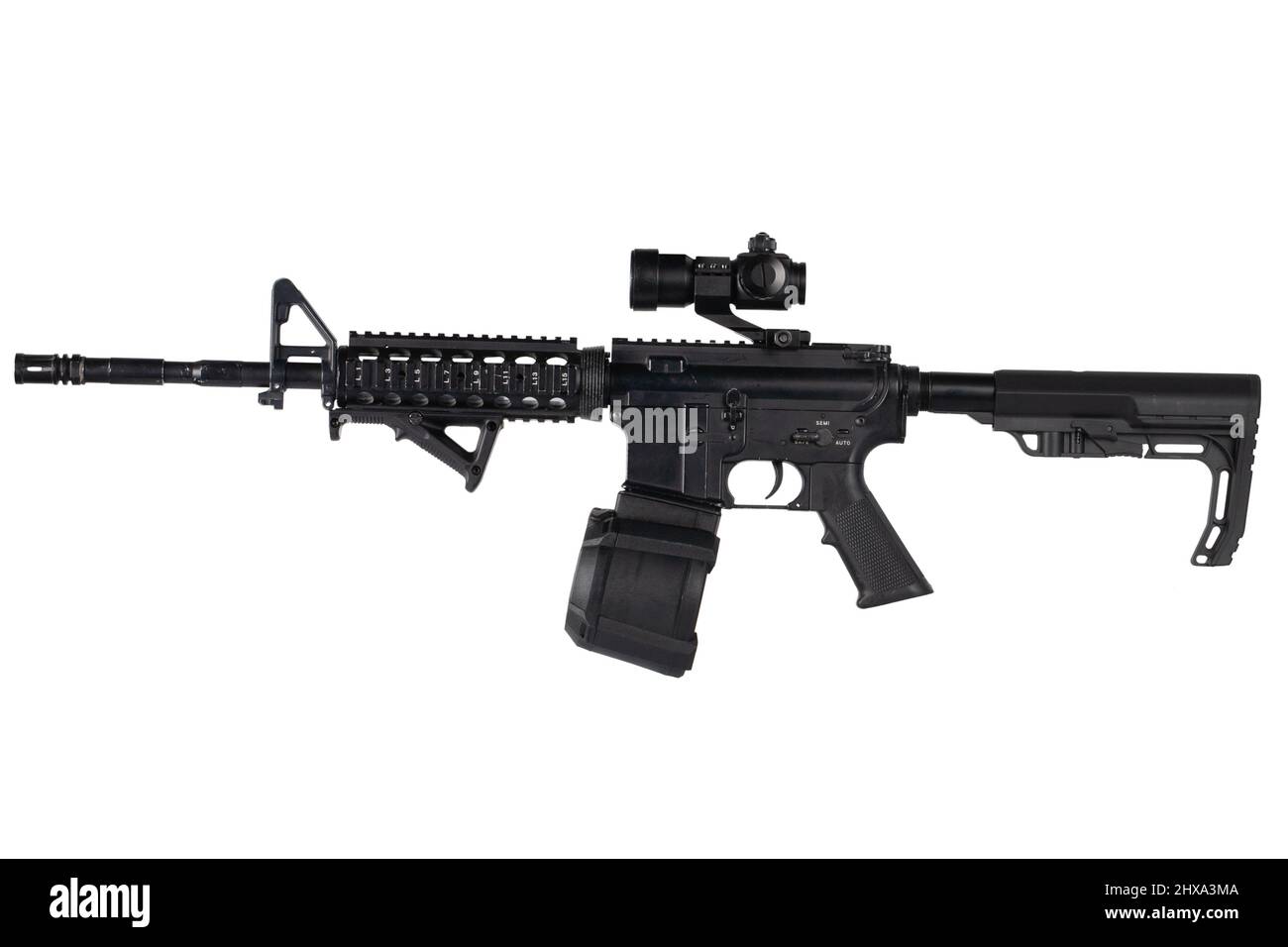 M4 assault rifle with optic scope and drum magazine isolated on a white ...