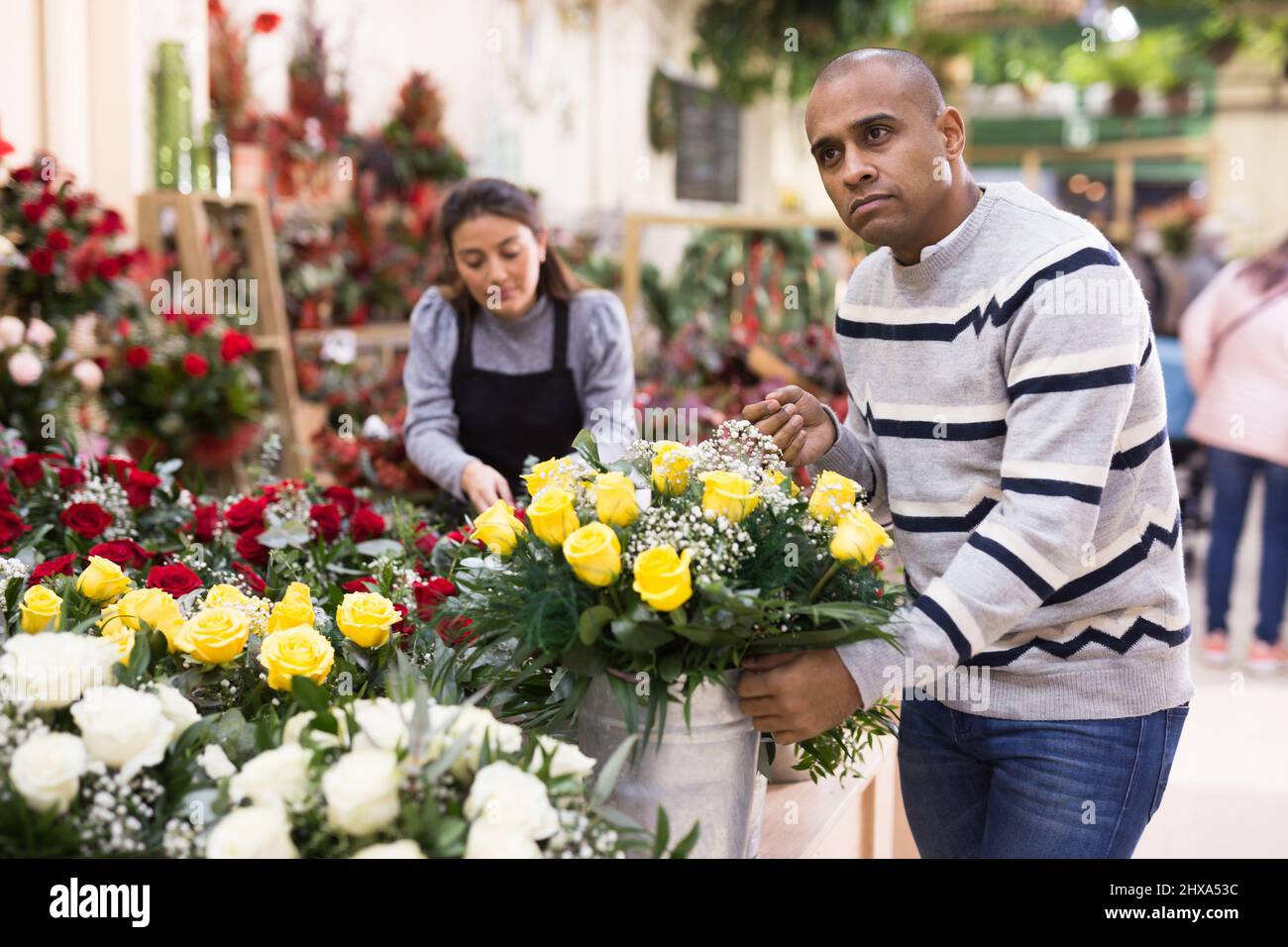Male customer chooses flower hi-res stock photography and images - Alamy