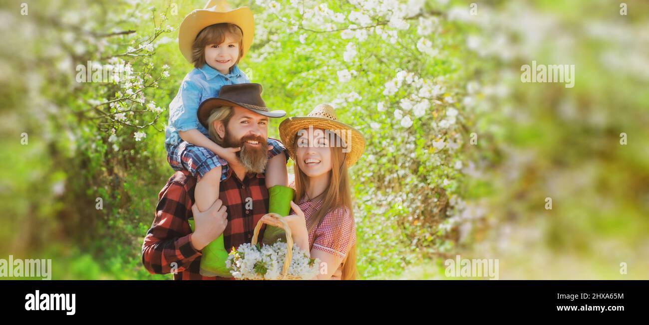 Spring banner with happy family. Cheerful family on picnic in a park ...