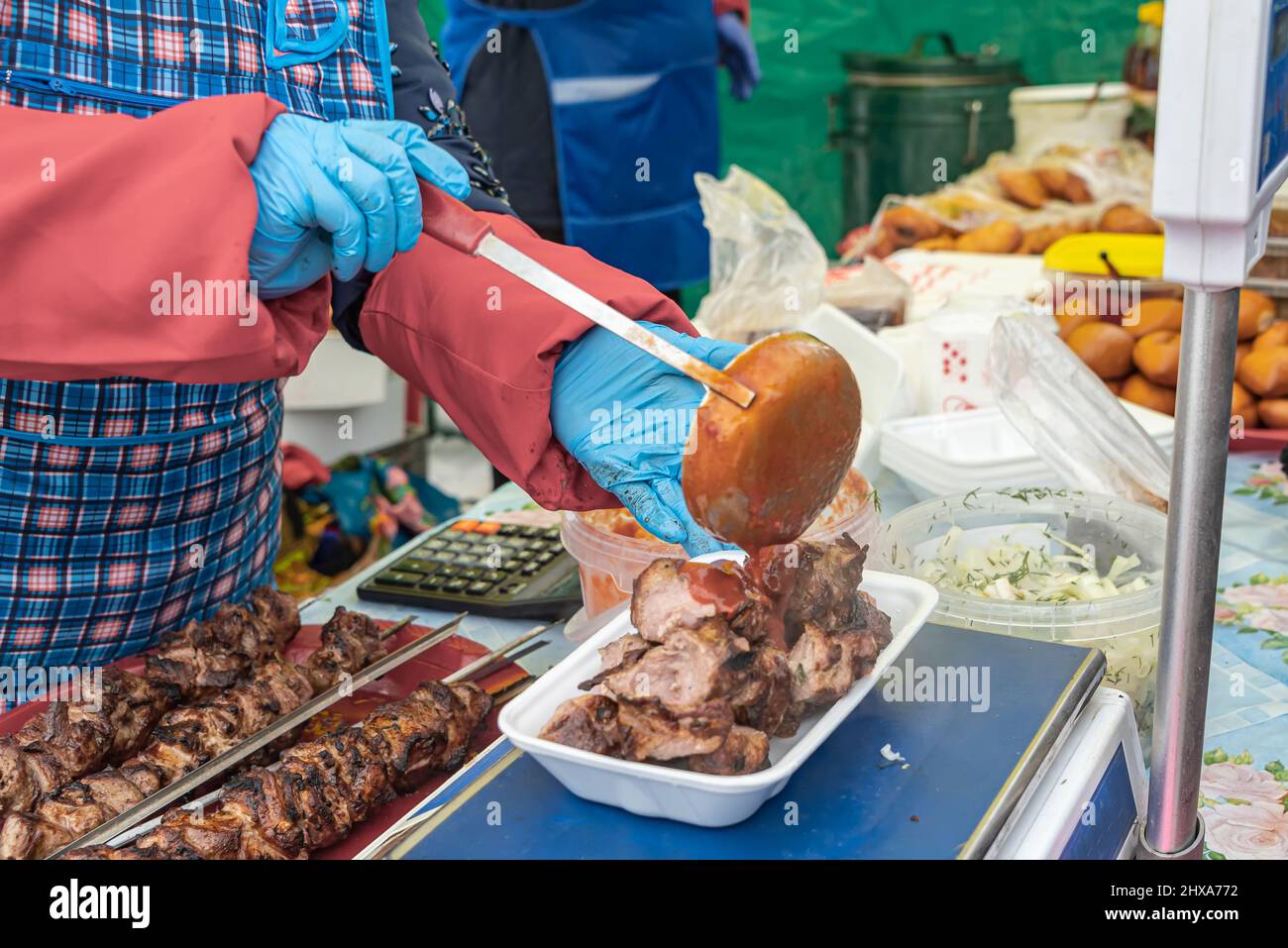 cooking and selling barbecue on the street in the field, hot meat food ...