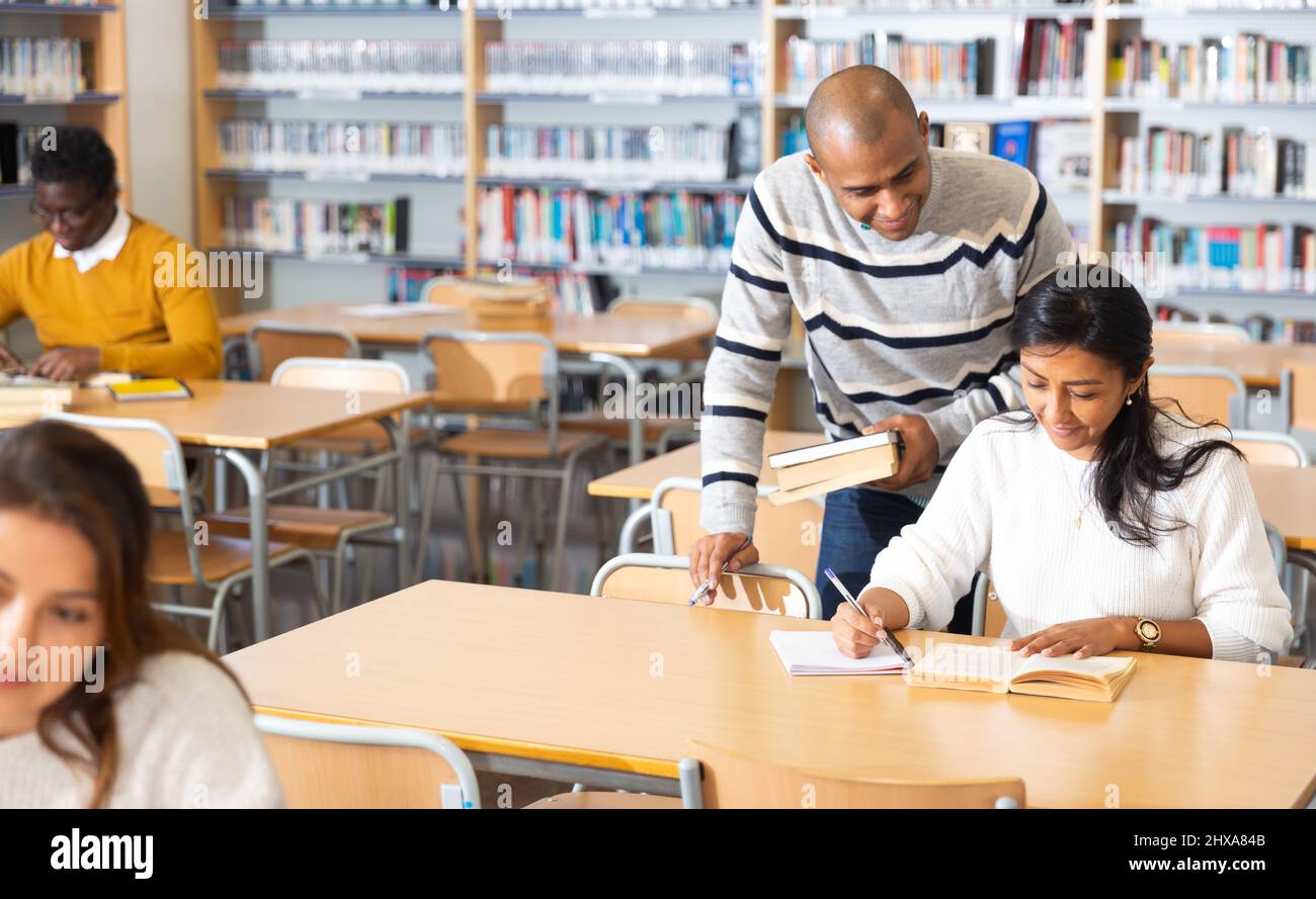 Adult people gaining skills at public library Stock Photo - Alamy