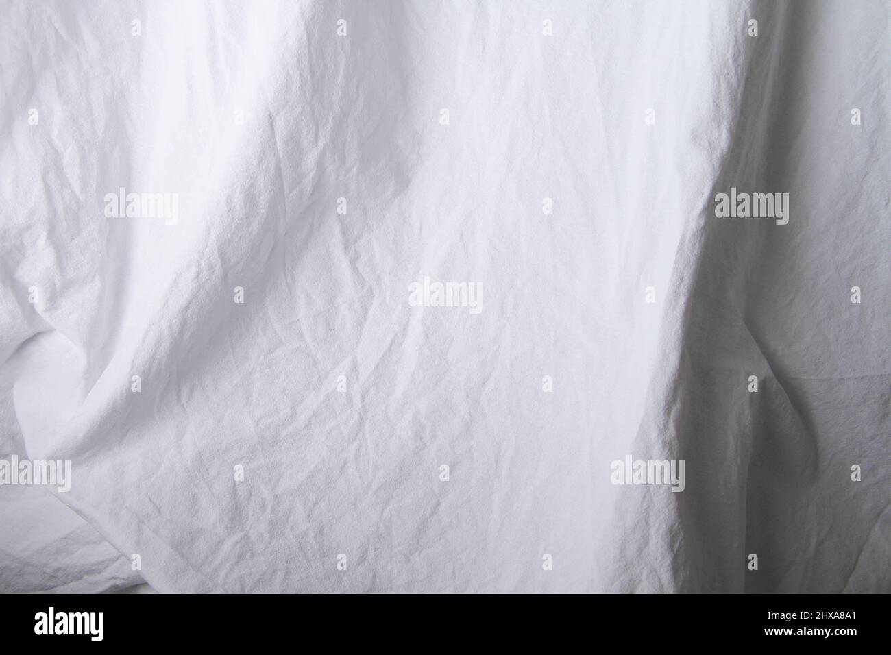 Texture of white fabric. White background close up. Factory fabric in ...