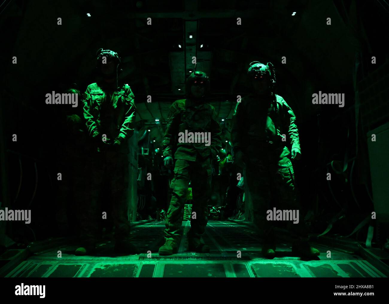 Loadmasters from the 41st Airlift Squadron use night vision goggles ...