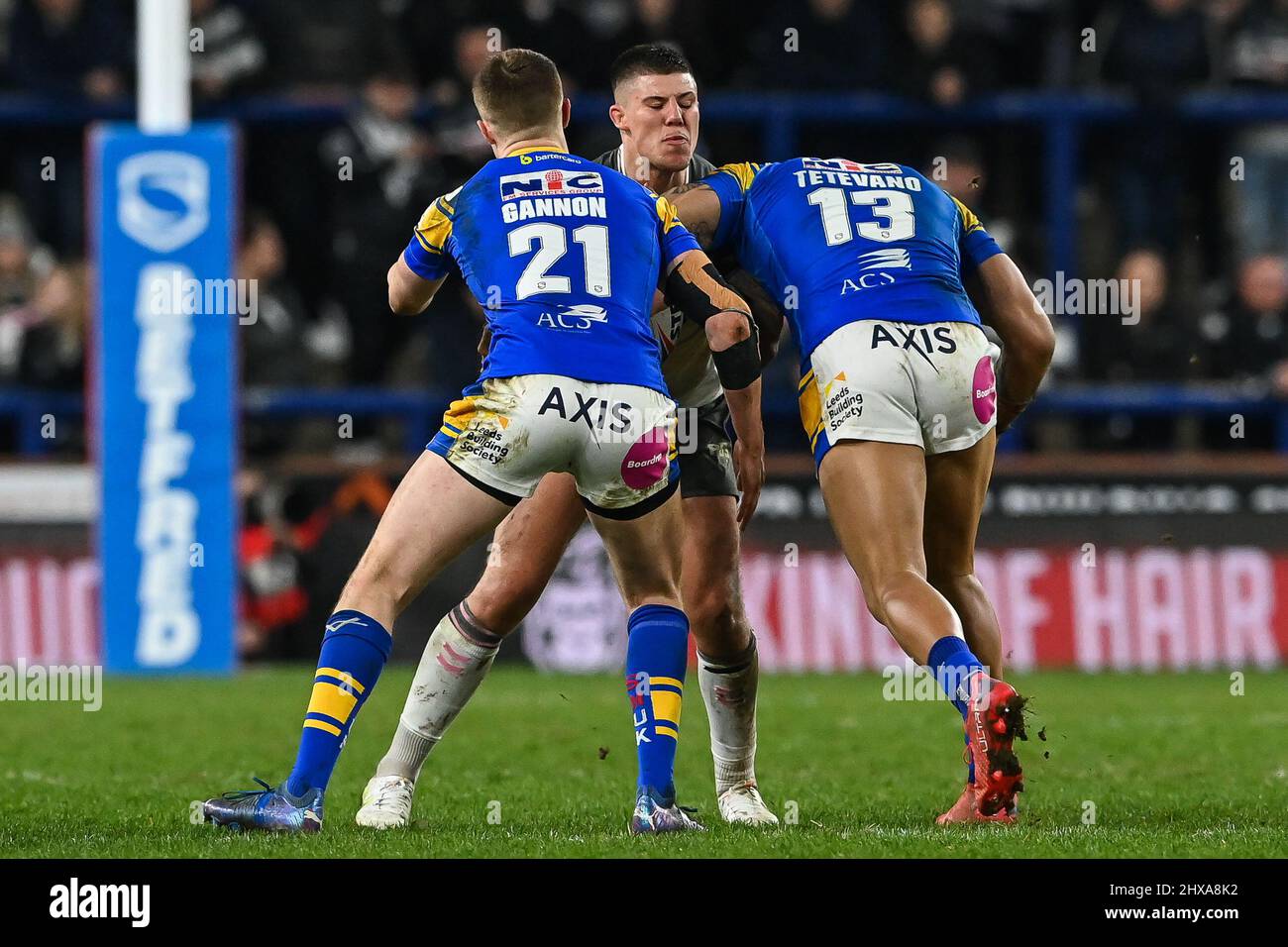 Joe Cator (15) of Hull FC is tackled by Morgan Gannon (21) and Zane ...