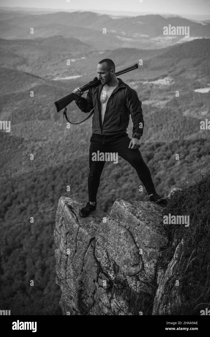 Wildlife Hunting. Hunter with shotgun gun after a hunt. Hunter with his ...