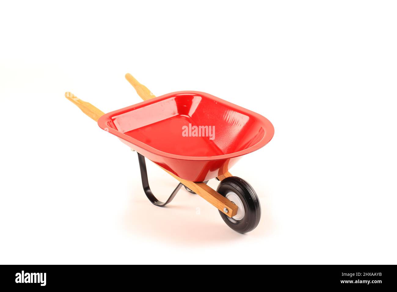 Wheelbarrow on white background Stock Photo - Alamy