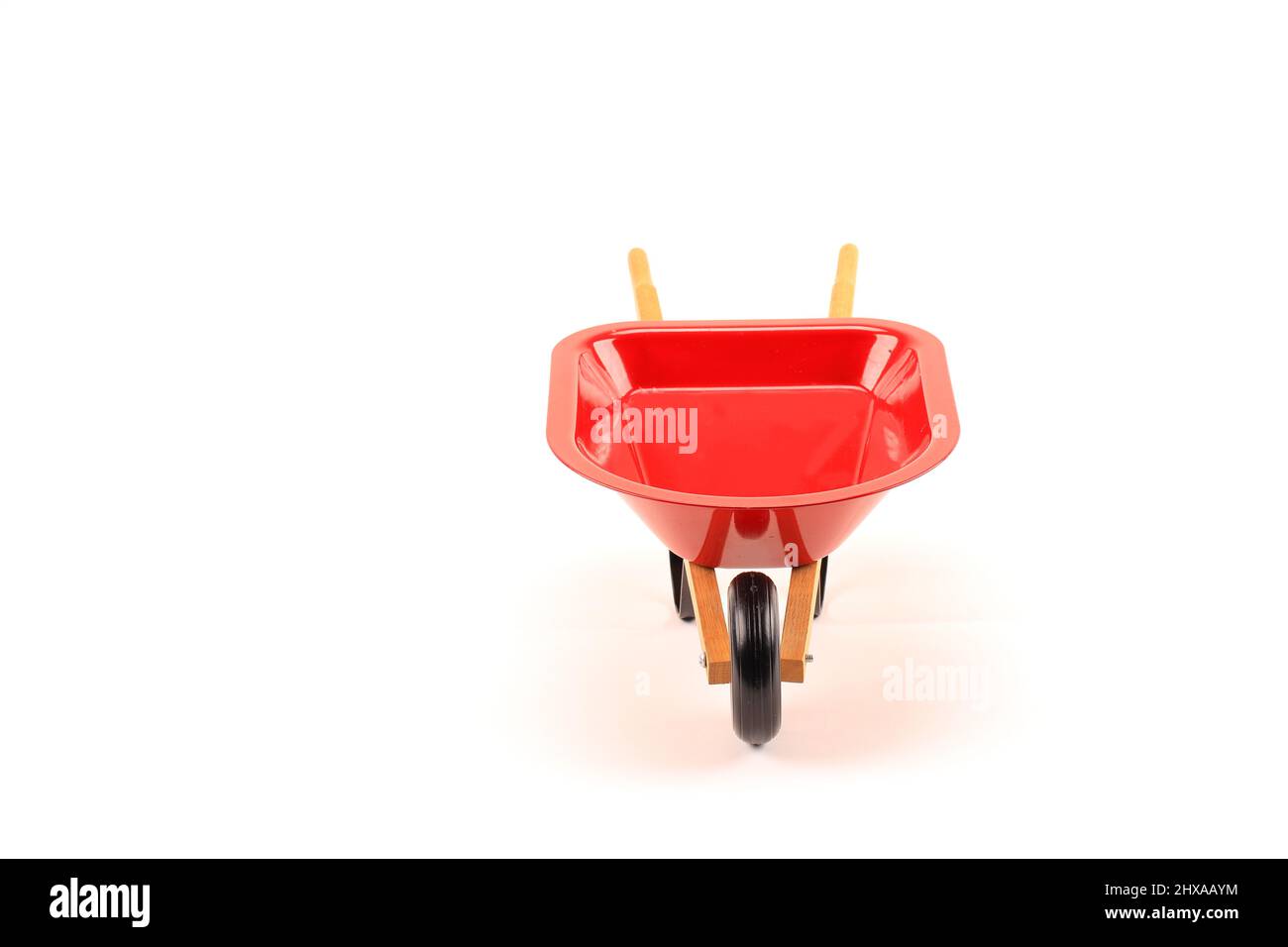 Wheelbarrow on white background Stock Photo - Alamy
