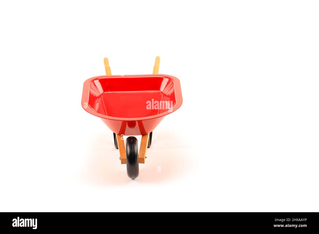 Wheelbarrow on white background Stock Photo - Alamy