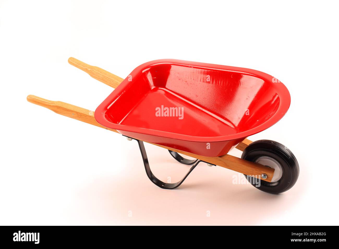Wheelbarrow on white background Stock Photo - Alamy