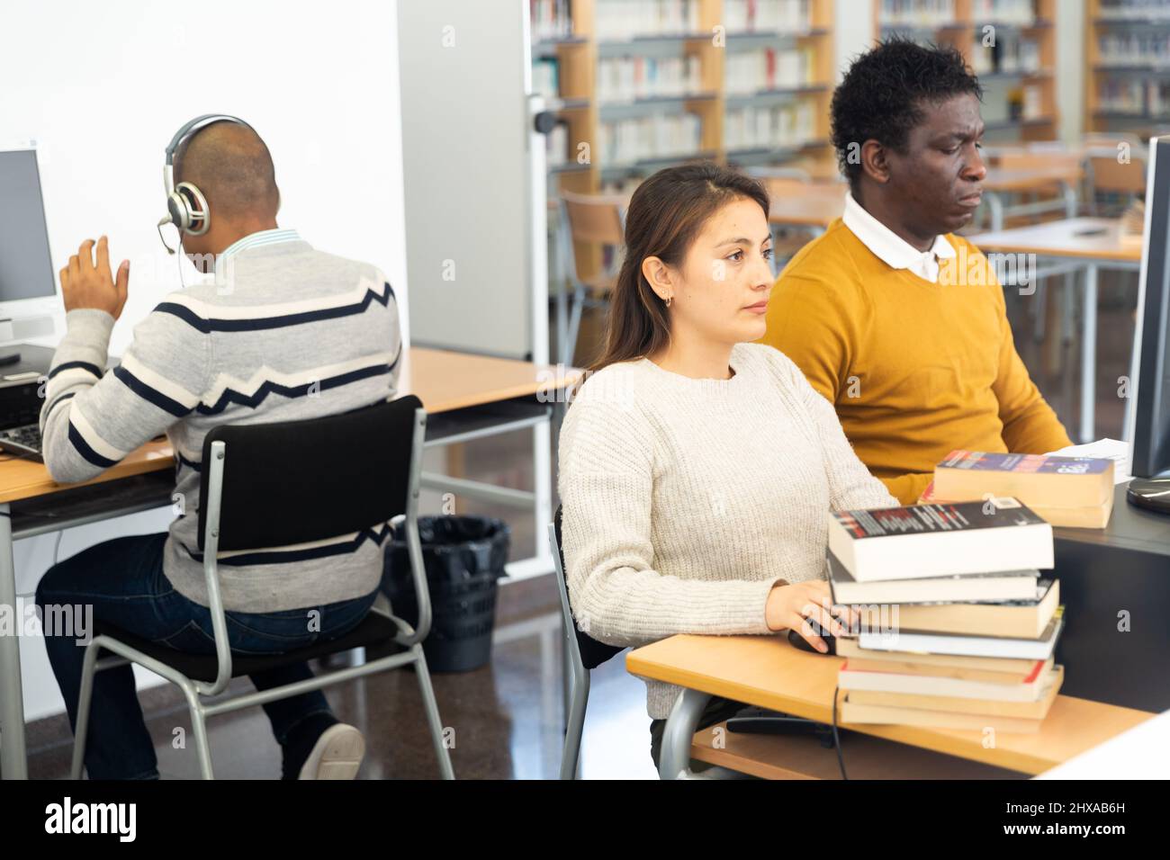 Young adult woman studying in computer class Stock Photo - Alamy