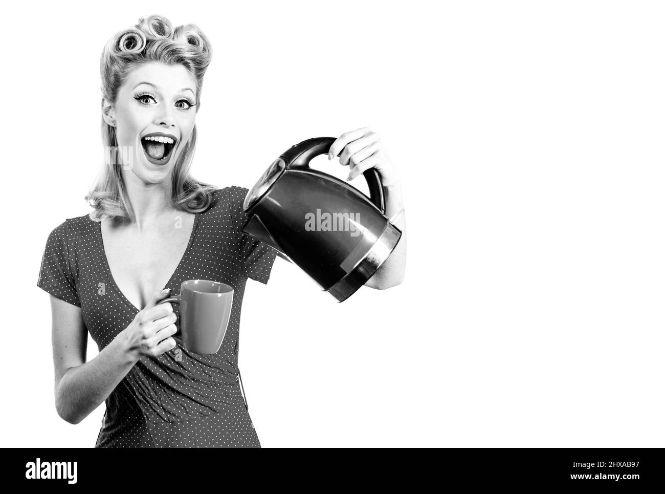 Funny blonde pinup woman making tea. Female model filling mug with hot ...