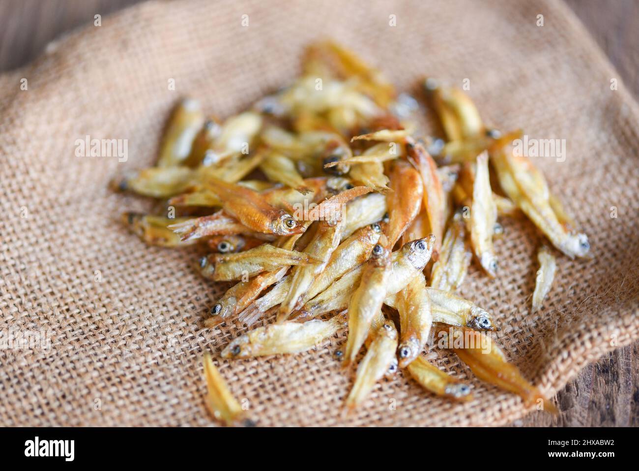 Small dried fish on the sack background, Crispy fish for snack Stock ...